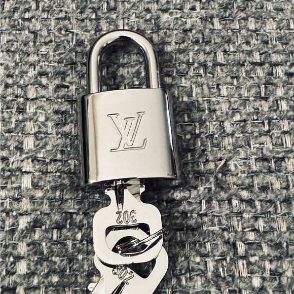 Jewelry | Louis Vuitton Silver Lock | Poshmark